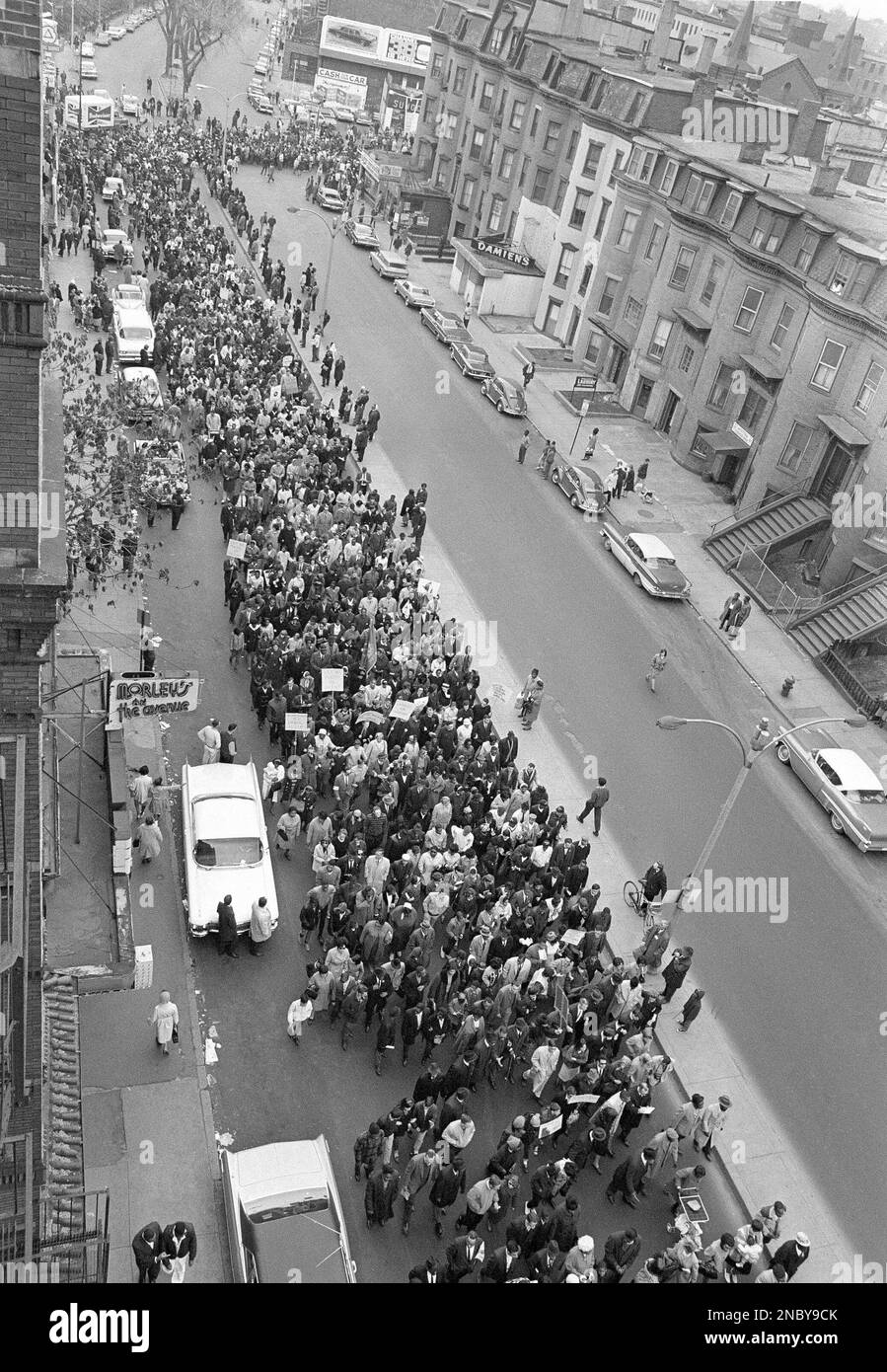 Civil rights marchers parade down Columbus Ave. in Boston led by Dr ...