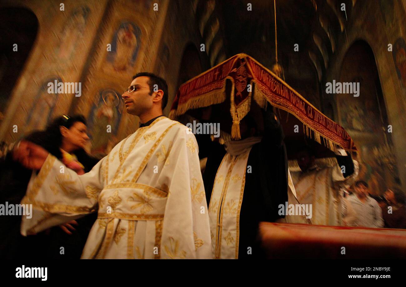 Bulgarian Orthodox priests carry a pall during a mass at Alexander ...