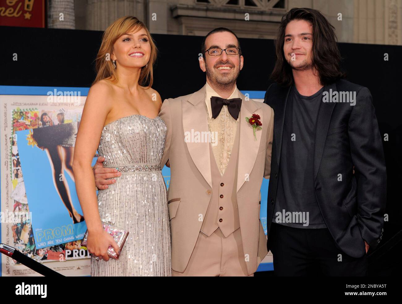 Joe Nussbaum, center, director of "Prom," poses with cast members Aimee ...