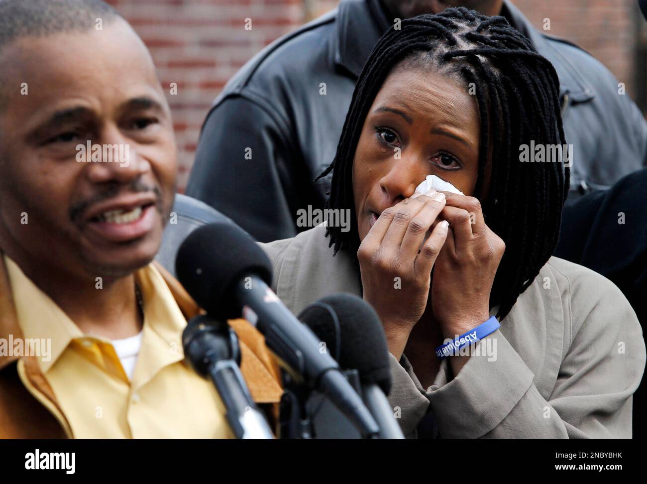 Wayne Dozier, of Boston, left, grandfather of college football player ...