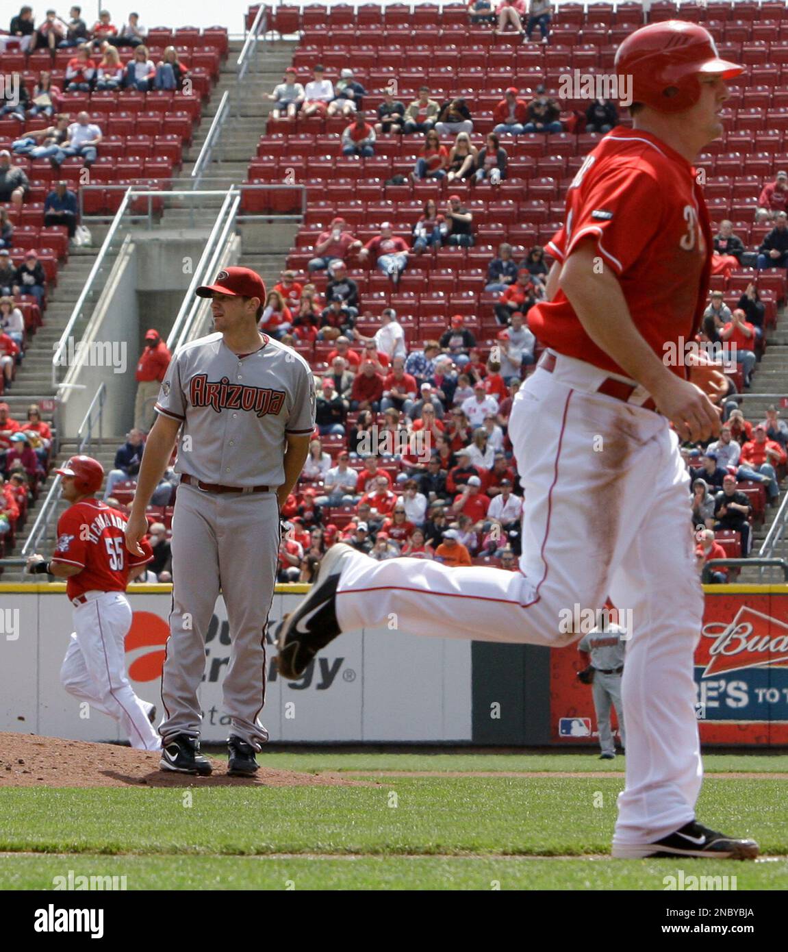 Cincinnati Reds' Jay Bruce, right, scores after Arizona Diamondbacks ...