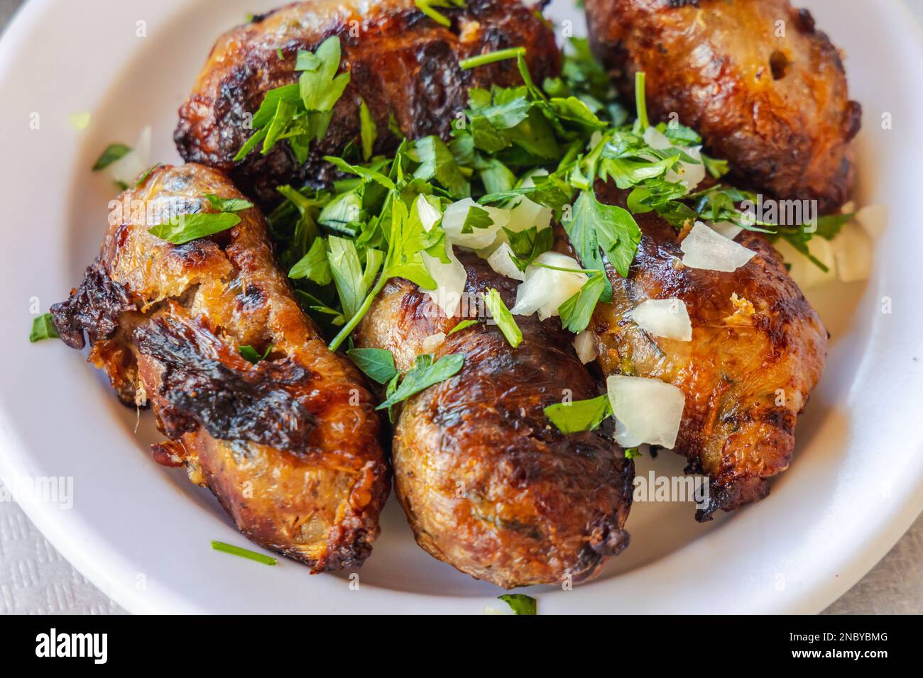 Traditional sausages called Sheftalia - meze dish on a plate in Cyprus ...