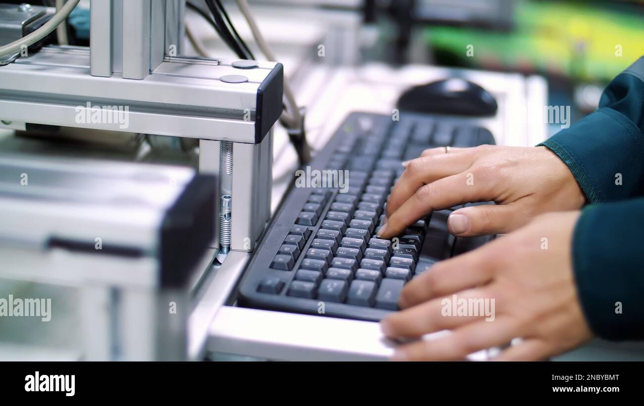 A close-up, hands work on the keyboard. a worker at an enterprise, a ...