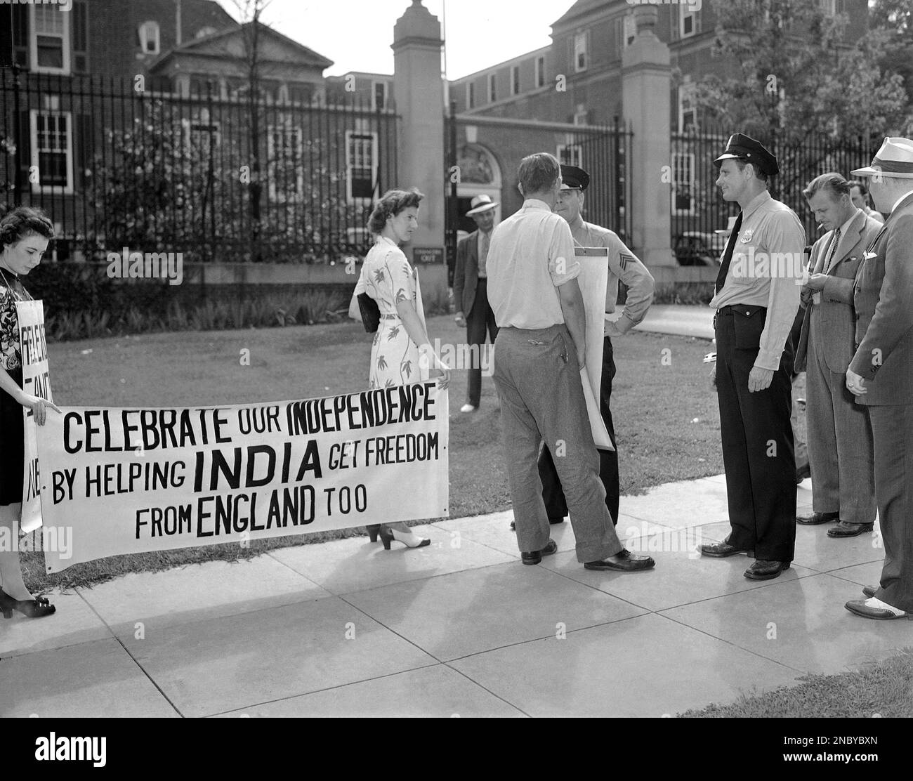Protestor walking holding social issues building exterior hi-res stock ...