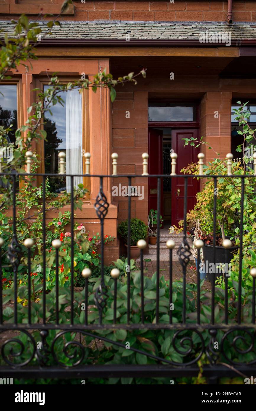 Front Cottage Garden with Iron Fencing Stock Photo - Alamy