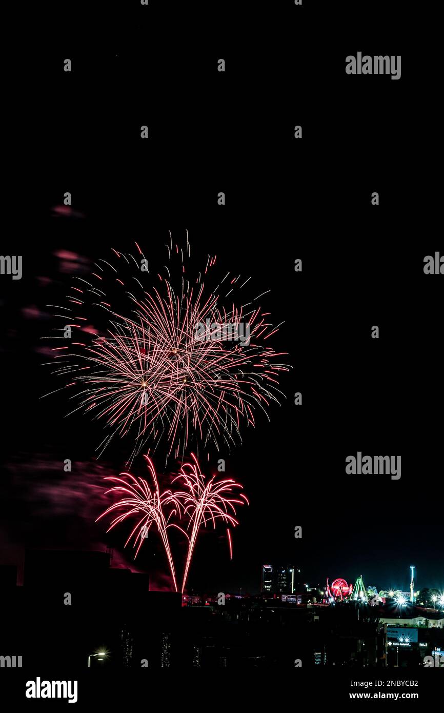 Vertical image of a fireworks show with pyrotechnics launched at ...