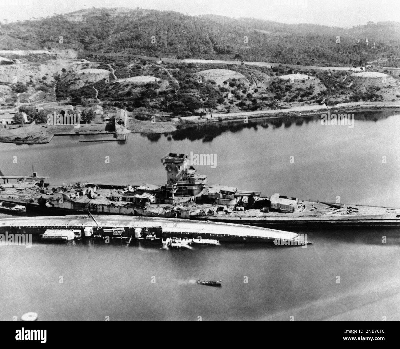 The damaged French battleship Strasbourg rides in the water near Toulon ...