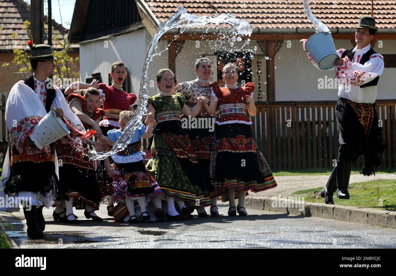 Boys of the Matyo minority dressed in their traditional clothing pour ...