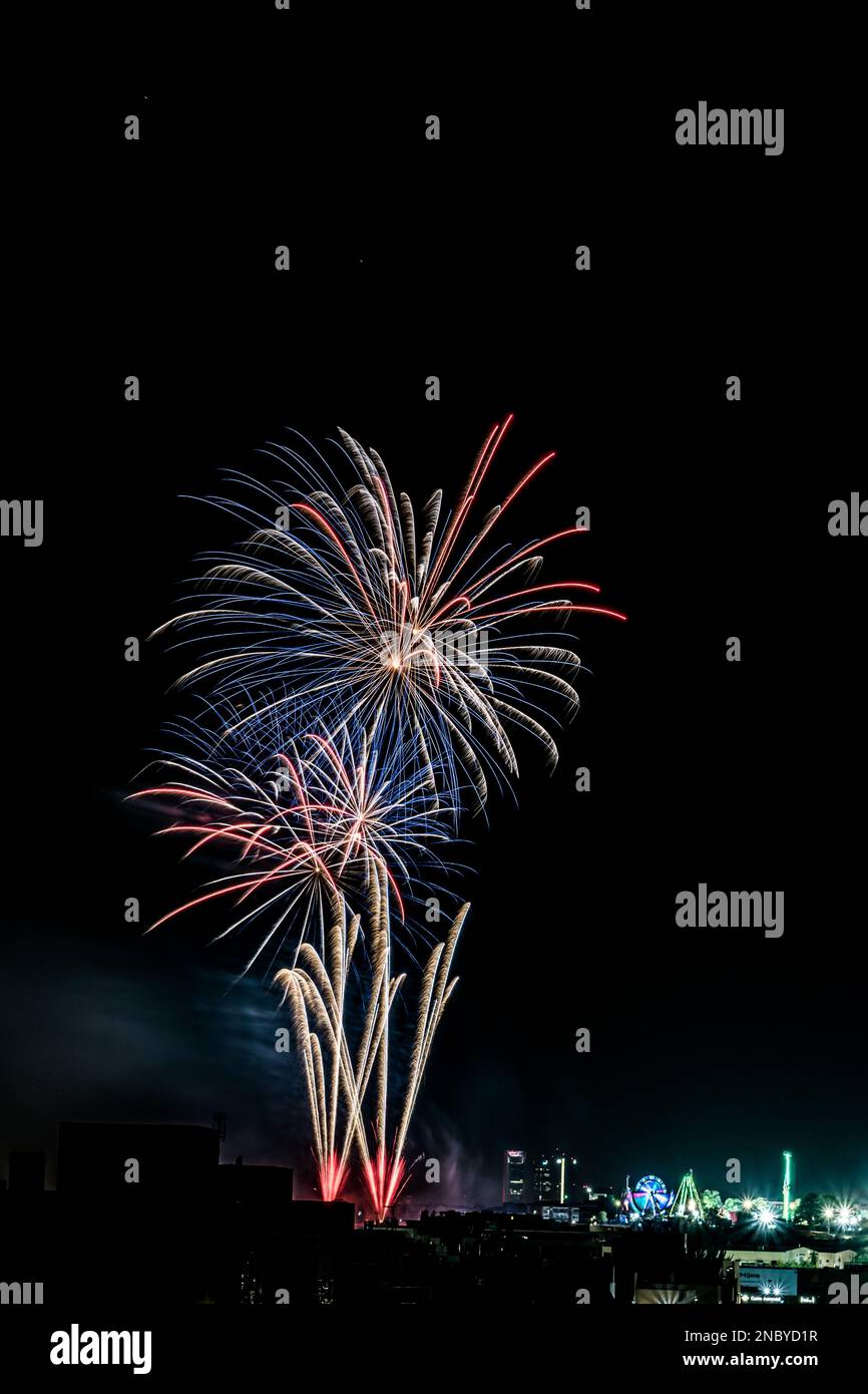 Vertical image of a fireworks show with pyrotechnics launched at ...