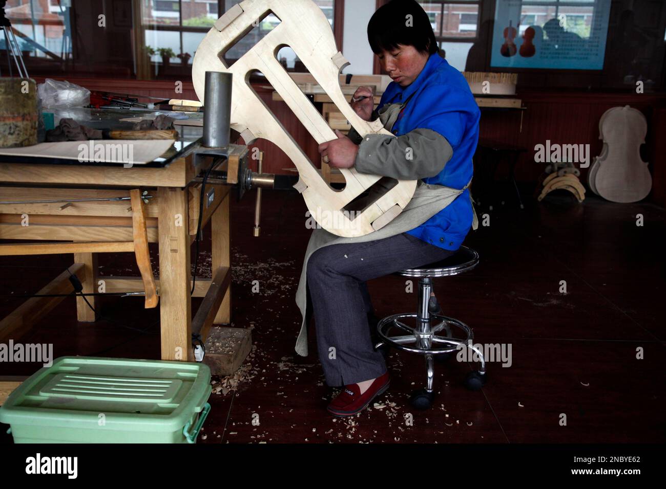 In this photo taken Wednesday, April 20, 2011, a woman handcrafts a ...