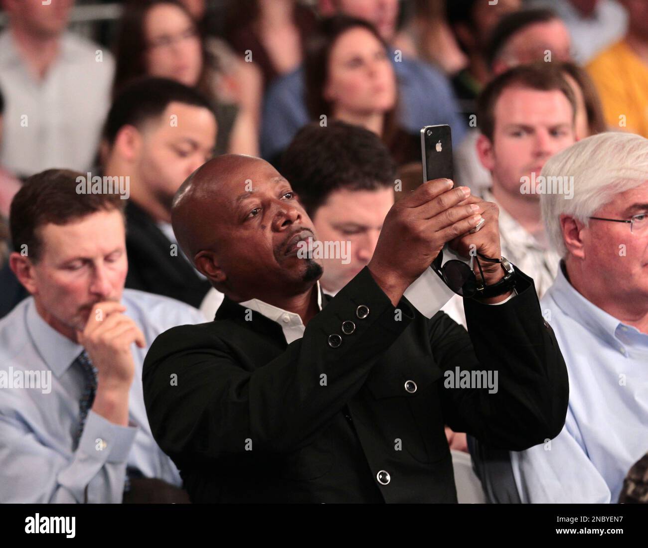 Music Rapper Stanley Kirk Burrell a.k.a., MC Hammer uses his Iphone ...