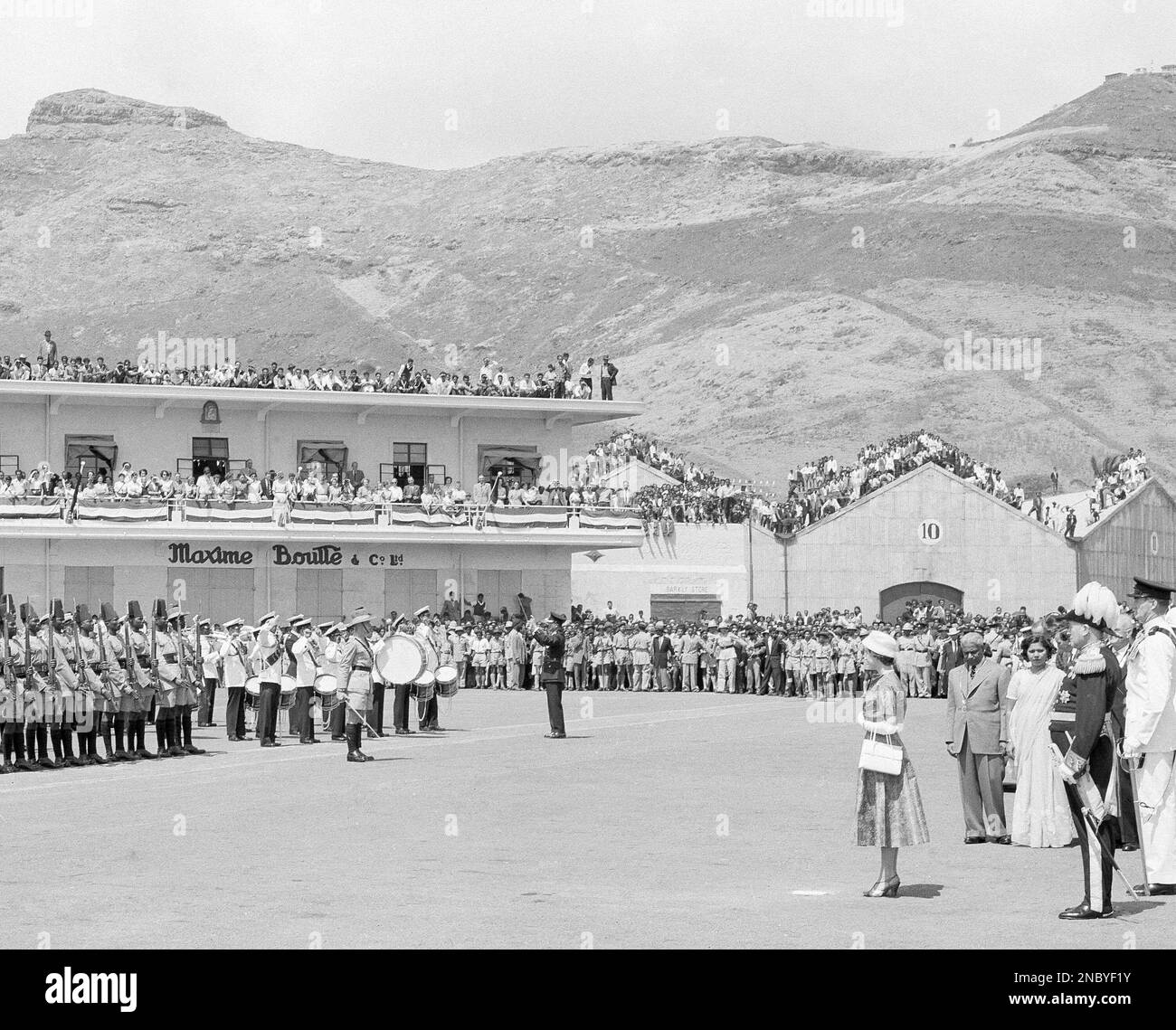 Mauritians crowd the roofs and every available vantage point to see ...