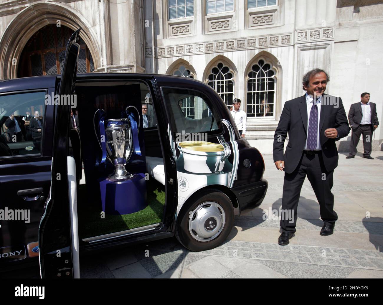UEFA President Michel Platini, right, poses for the photographers next ...