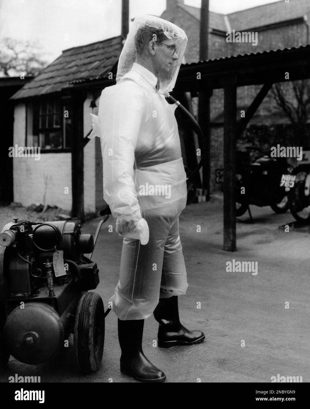 This man demonstrates one of the new plastic suits made to protect ...
