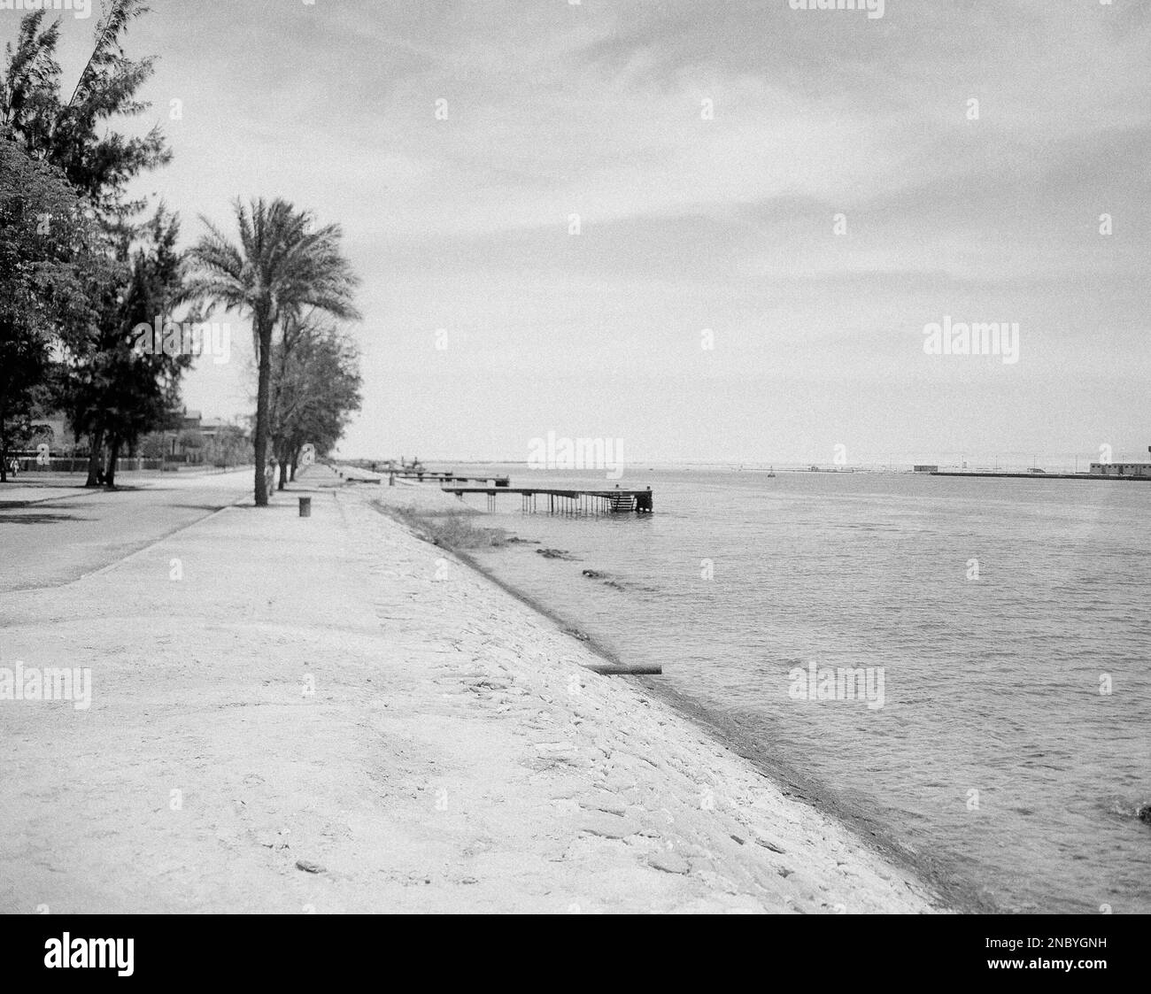 The canal from the Port Tewfik side shows causeway and small docks for ...