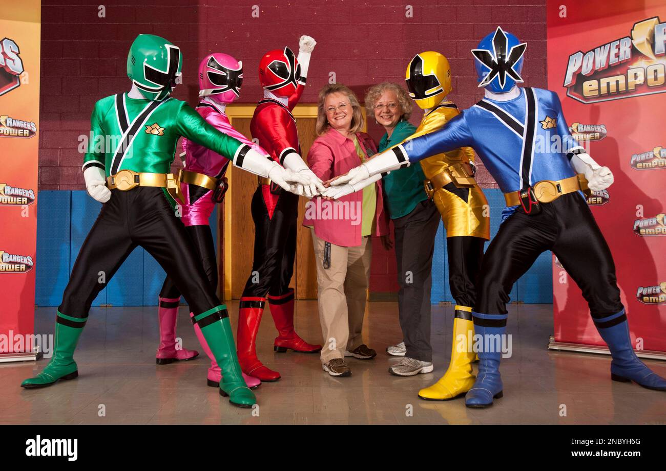 The Power Rangers stand with Caolyn Adams, center, and her sister ...