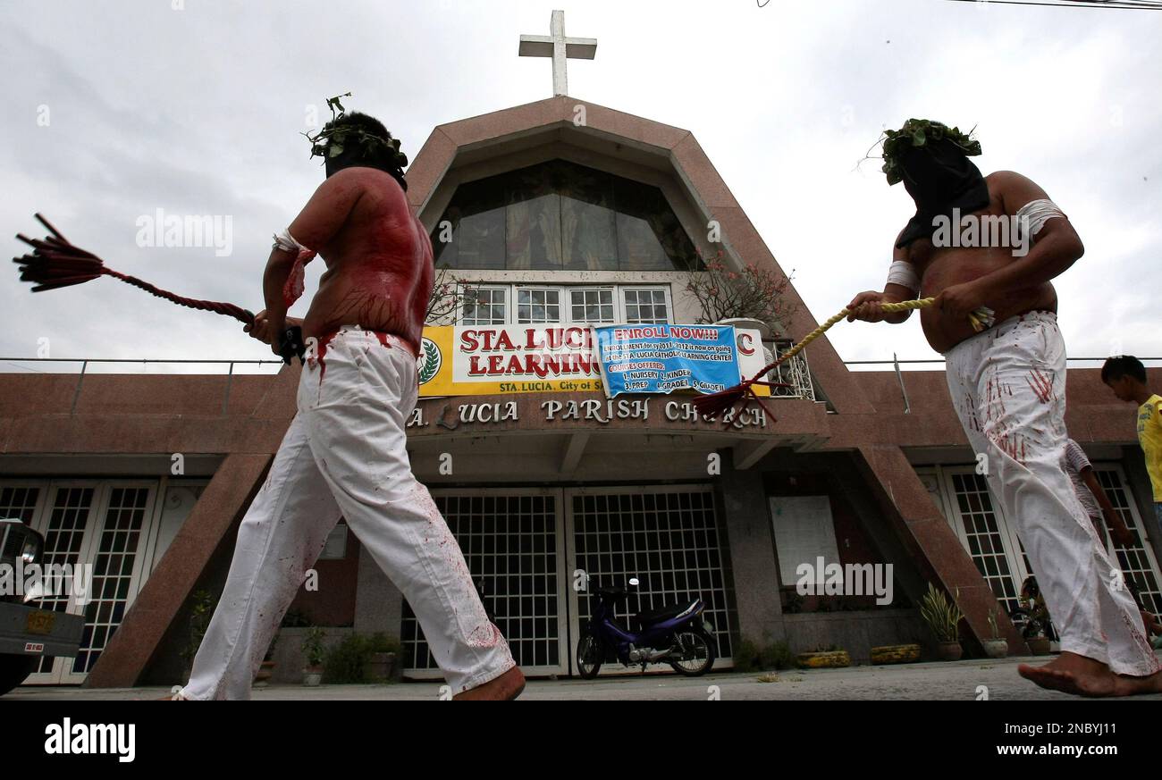 A couple of penitents flagellate themselves to reenact the sufferings ...