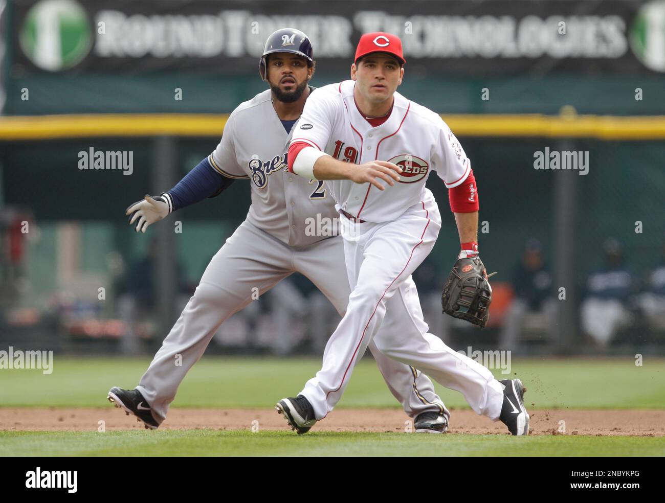 Cincinnati Reds first baseman Joey Votto (19) and Milwaukee Brewers ...