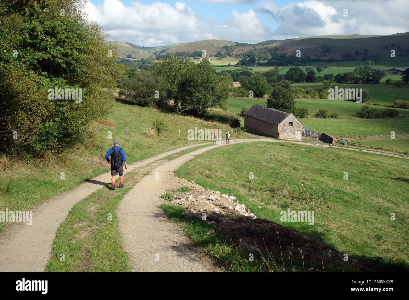 Three Men (Hikers) Walking on Track on Farmland to Beggars Bridge in ...