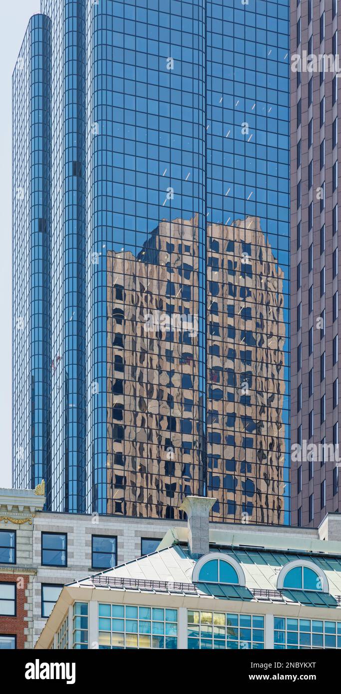 The blue glass of Exchange Place Boston (53 State Street) reflects 60 ...