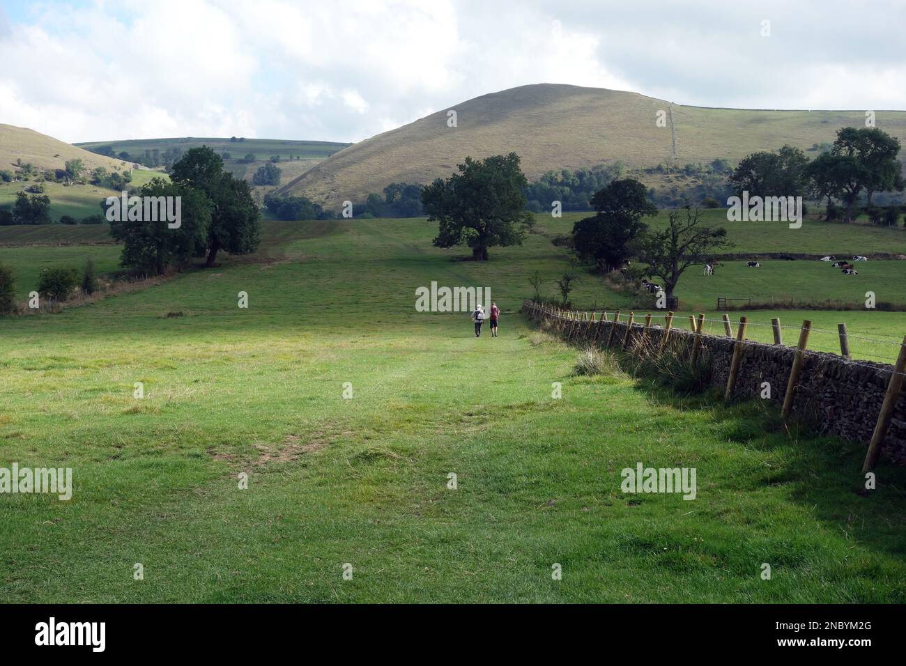 Two Men (Hikers) Walking on Path in Farmland by Stone Wall to Beggars ...