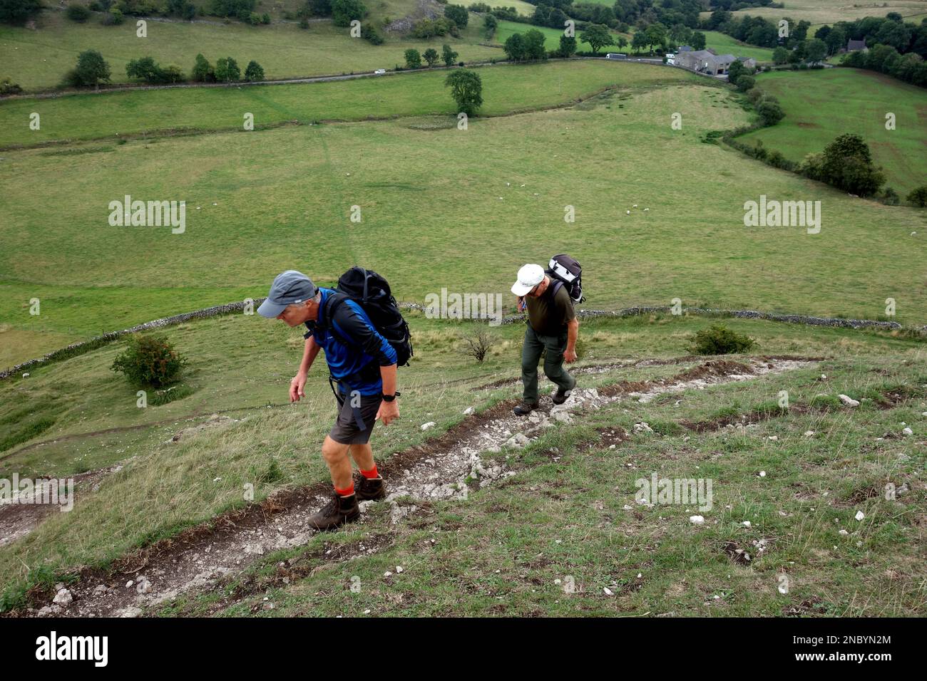 Two Men (Hikers) Walking on Path up Parkhouse Hill from near Glutton ...
