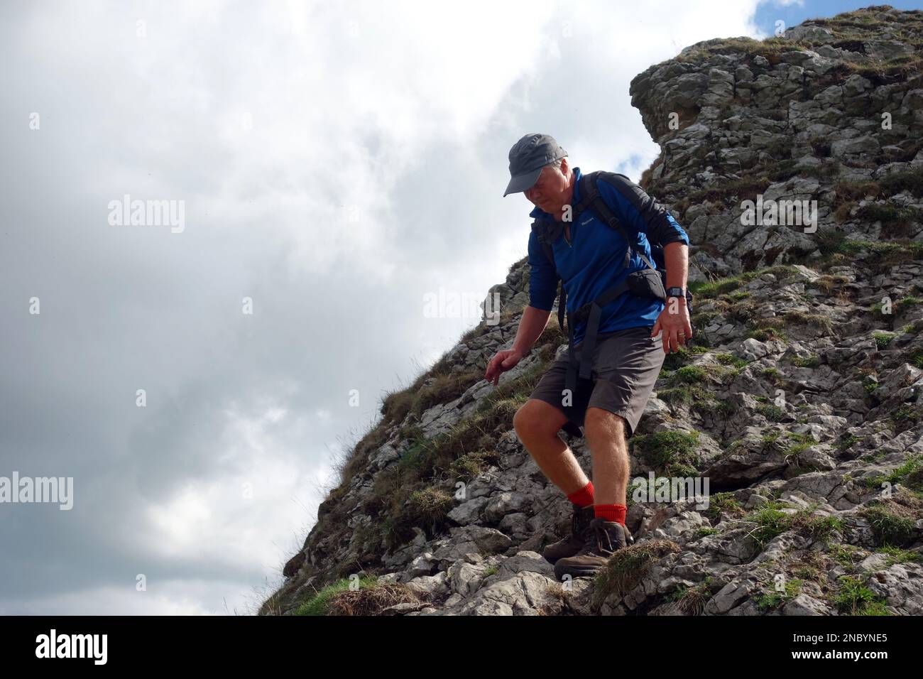 Old Man Walking Down Steep Rocky Crag from Parkhouse Hill in the Dove ...