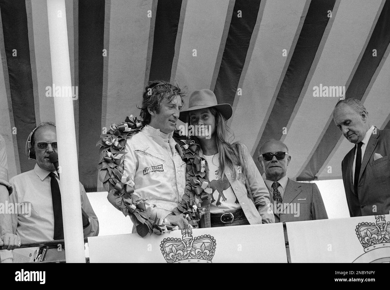Jochen Rindt, of Austria with his wife Nina beside him, wears the ...