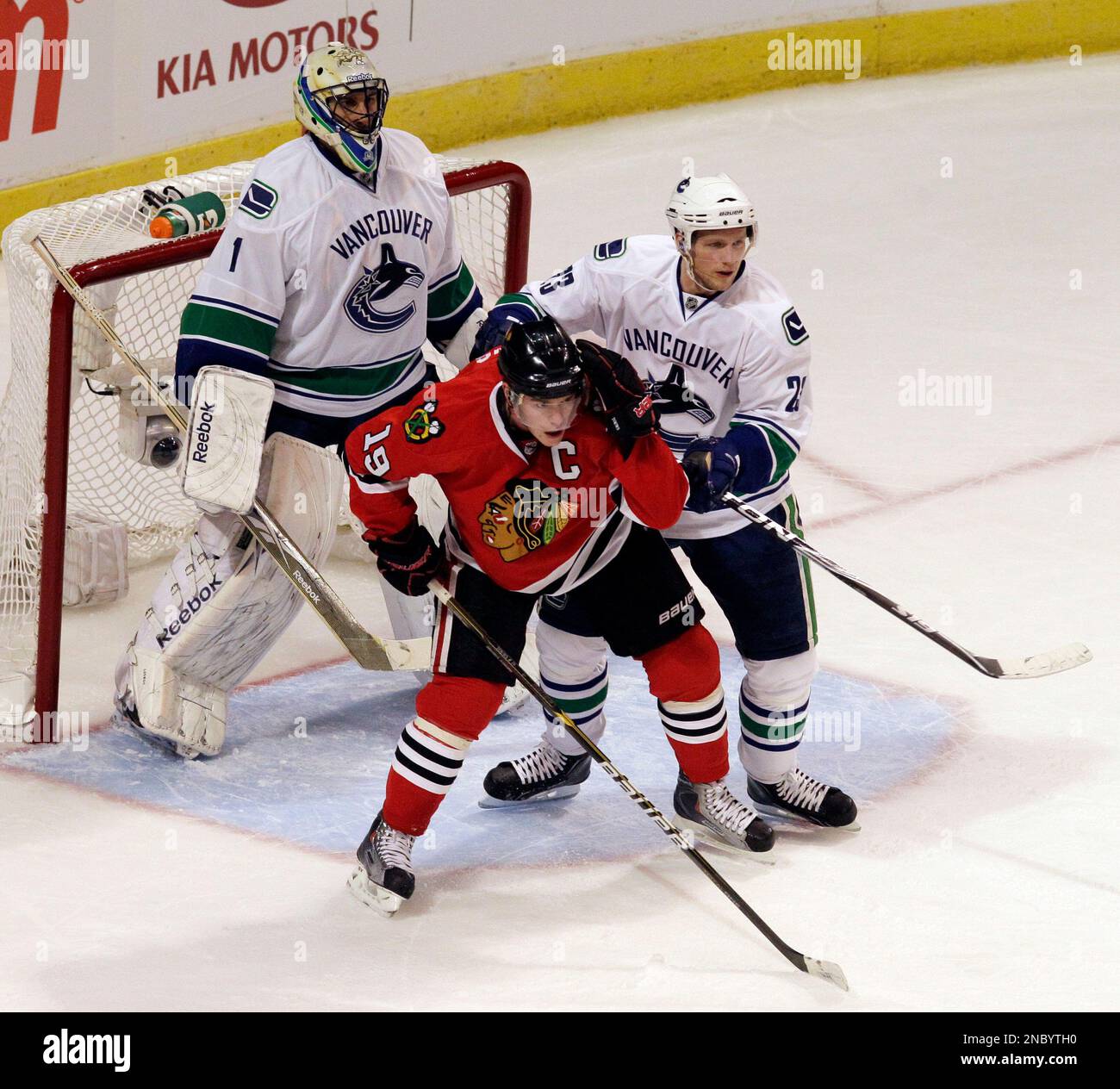 Vancouver Canucks' Alexander Edler, right, battles for a pass against ...