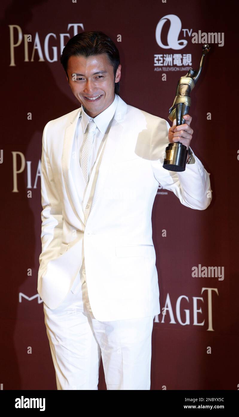 Hong Kong actor Nicholas Tse displays his trophy after winning Best ...