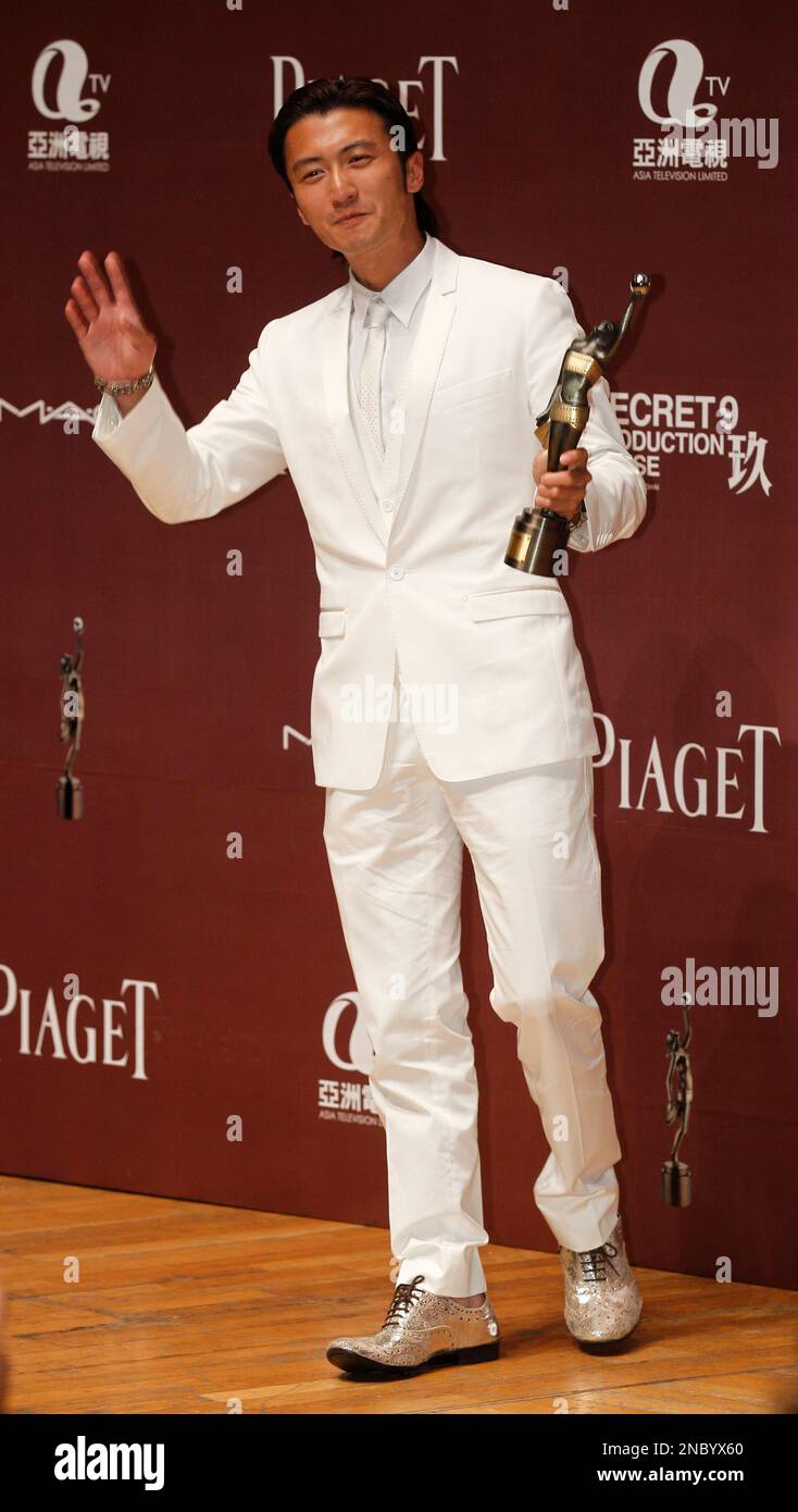 Hong Kong actor Nicholas Tse displays his trophy after winning Best ...