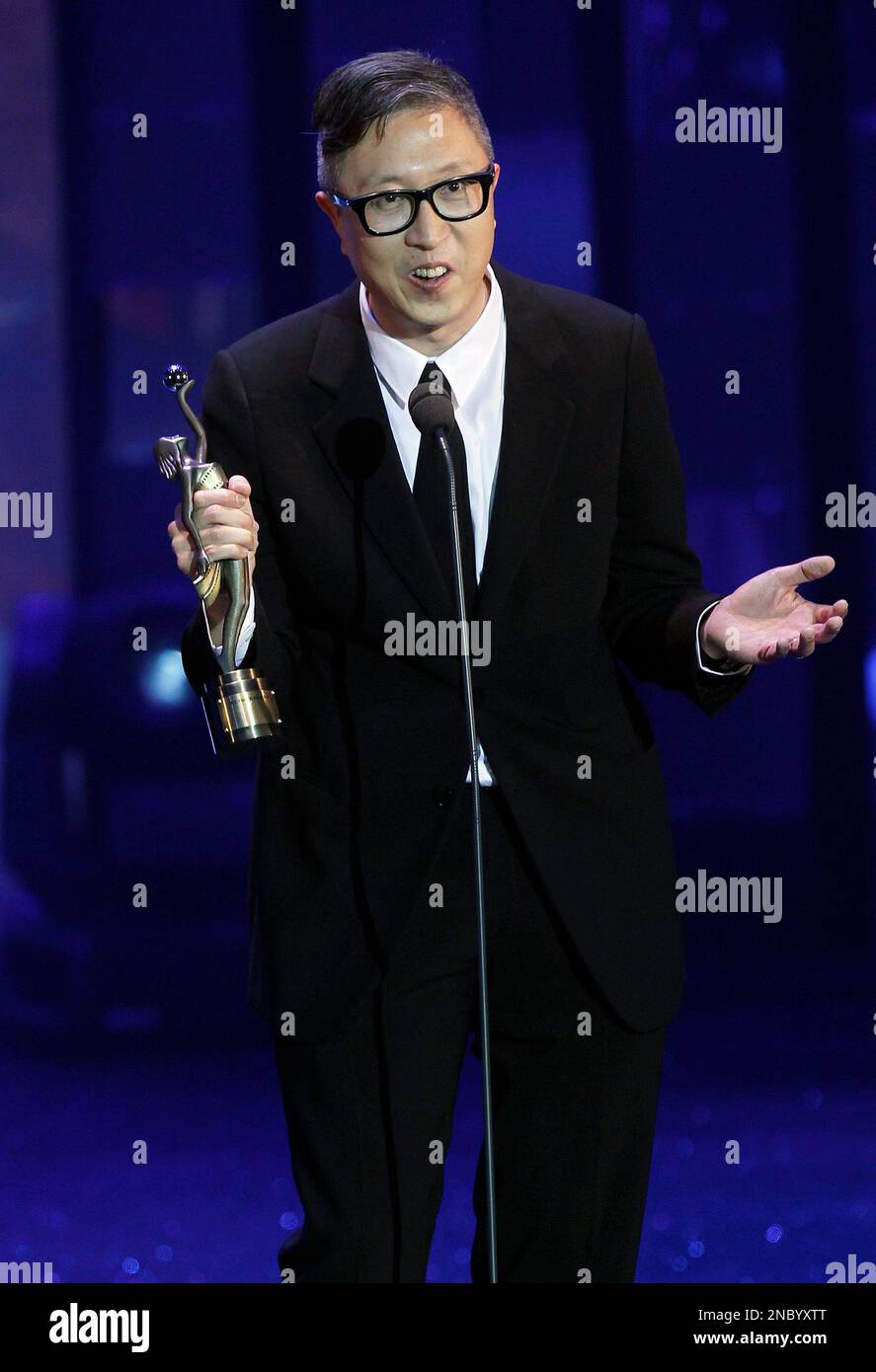 Hong Kong director Chong Man Keung celebrates with the trophy after ...
