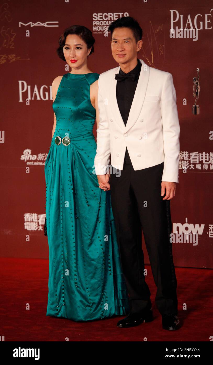 Hong Kong actor Nick Cheung and his wife Esther Kwan pose on the red carpet of the 30th Hong ...