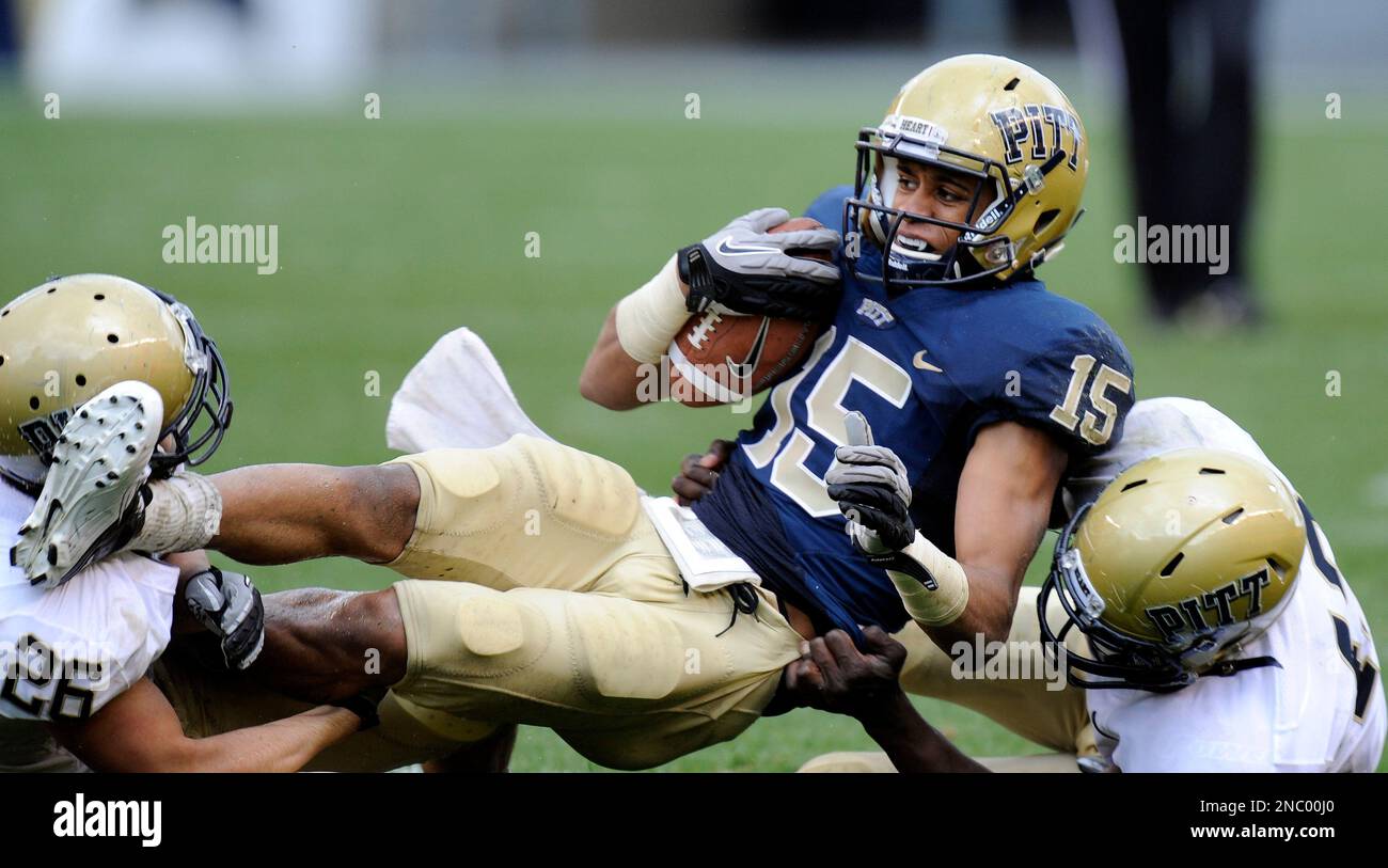 Blue wide receiver Devin Street (15) is tackled by Gold defensive back ...