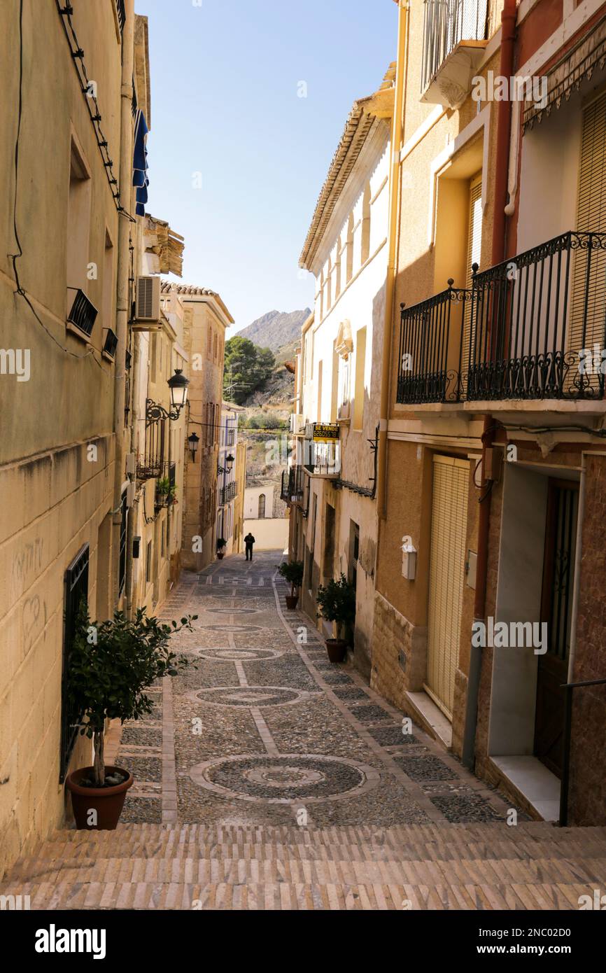 Relleu, Alicante, Spain- February 5, 2023: Narrow pebbled street and ...