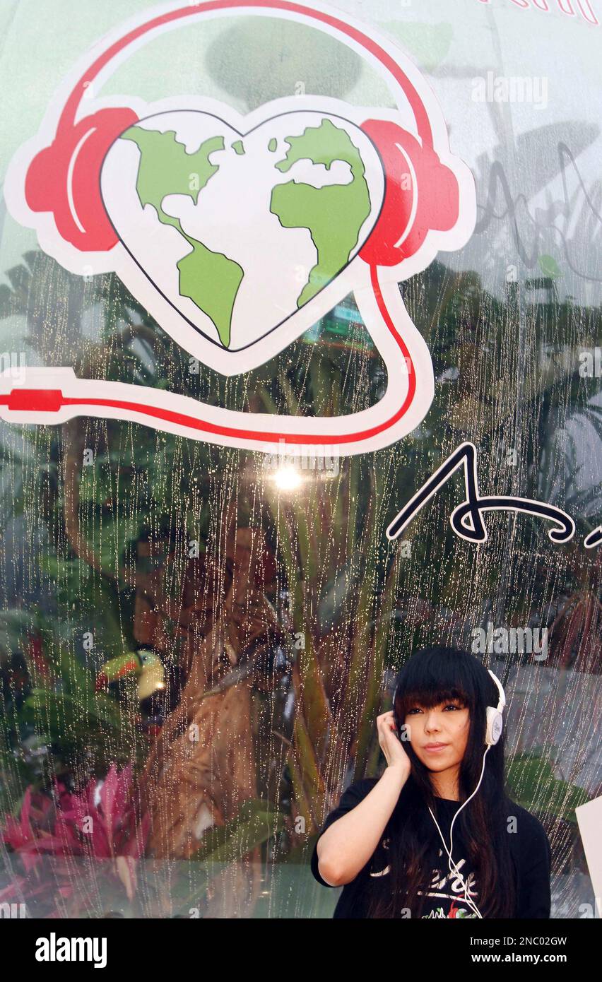 Taiwanese singer A-mei listens to some natural sound during an Earth ...