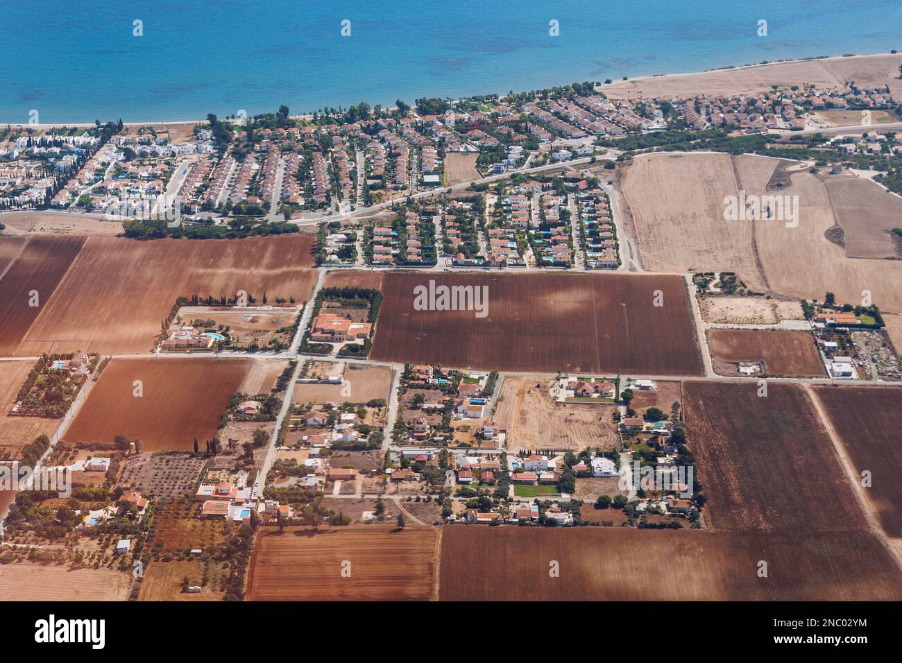 Pervolia village near Larnaca city seen from plane window, Cyprus ...
