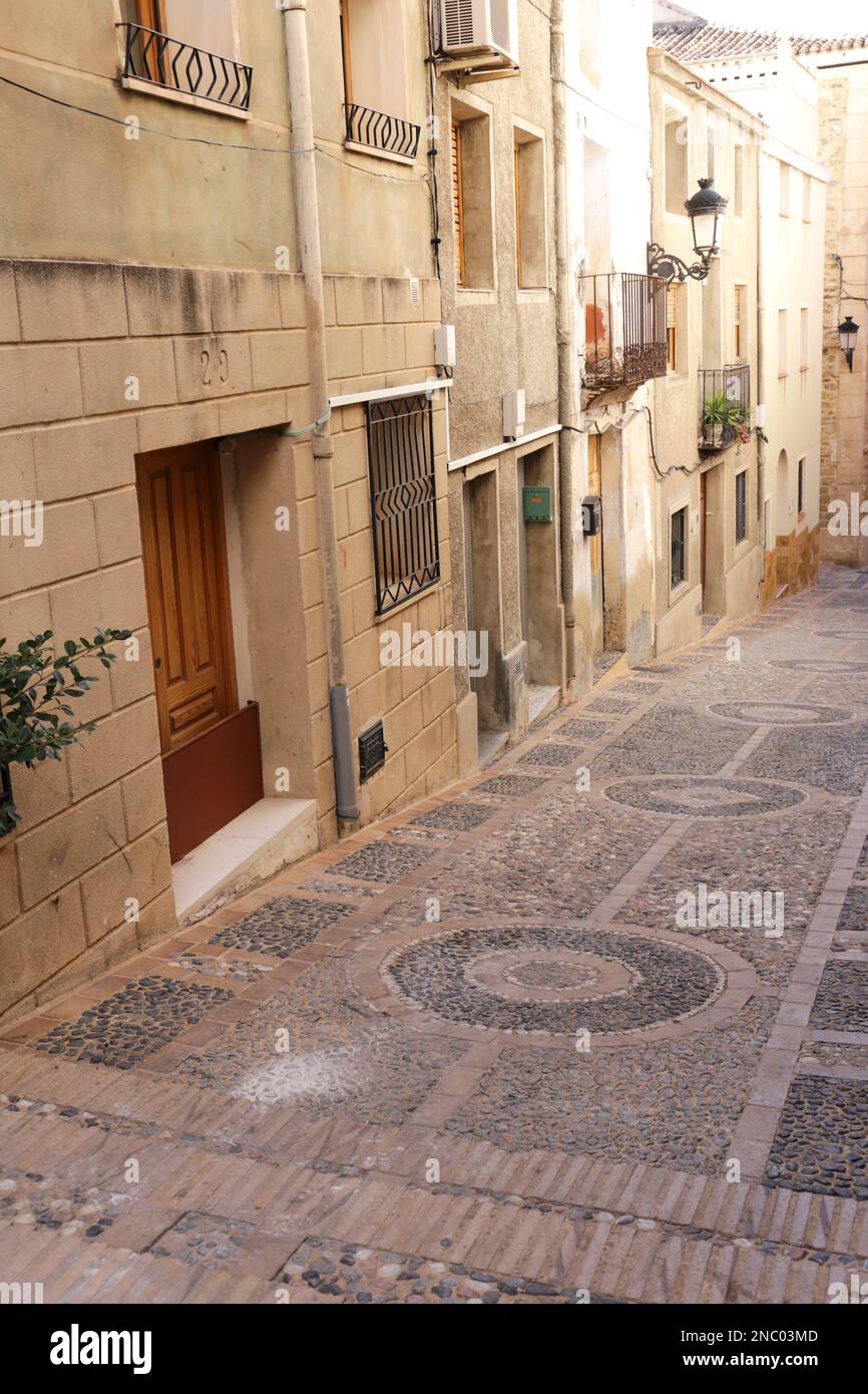 Relleu, Alicante, Spain- February 5, 2023: Narrow pebbled street and ...