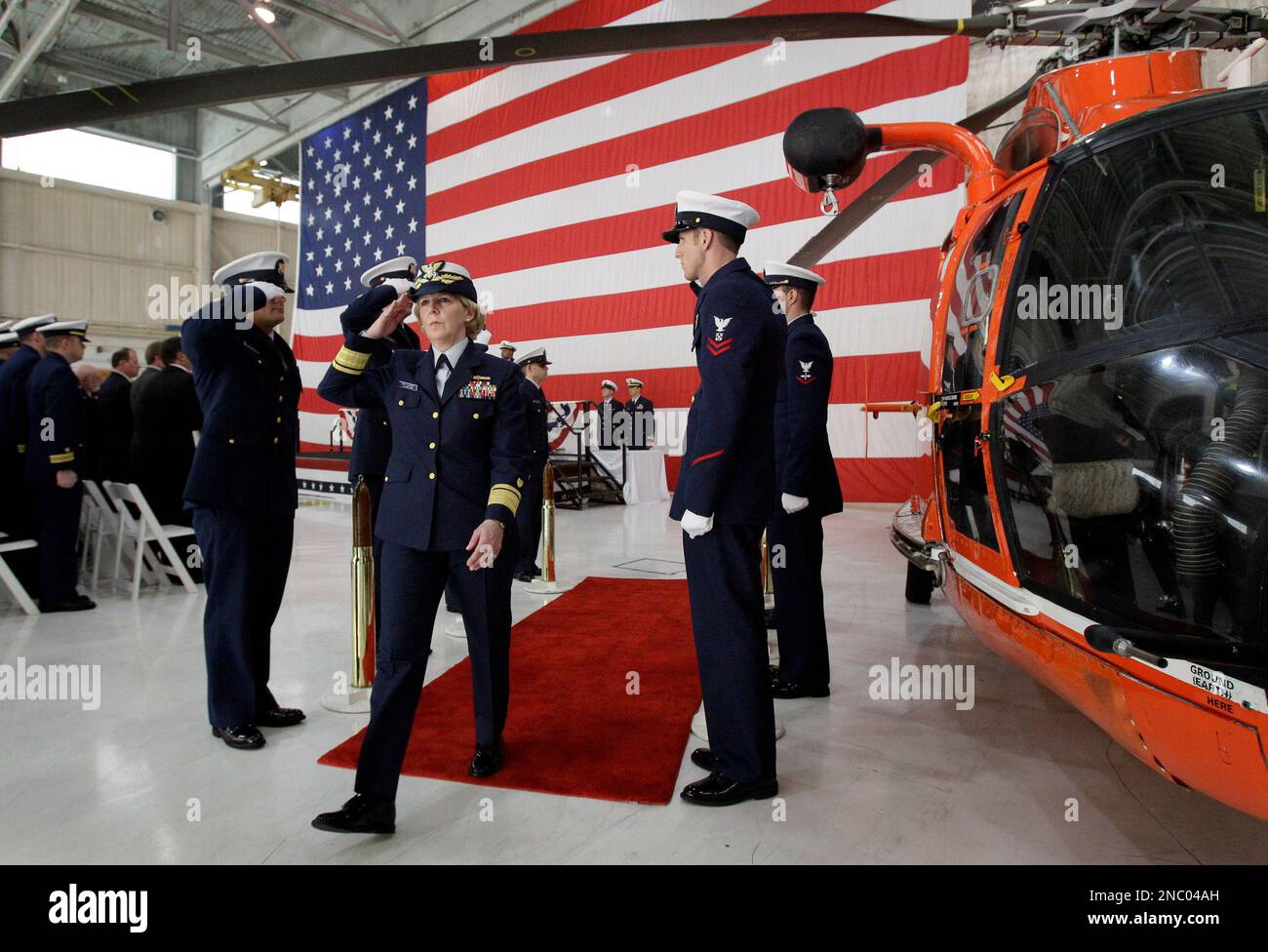 U.S. Coast Guard Rear Admiral Mary Landry salutes as she leaves a ...