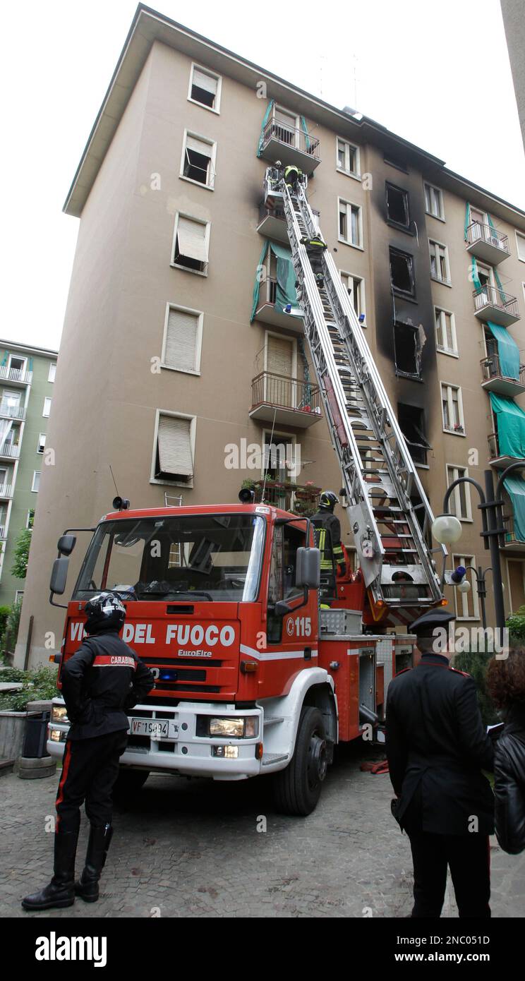 Firefighter intervene in a fire that broke out in flat in Milan, Italy ...