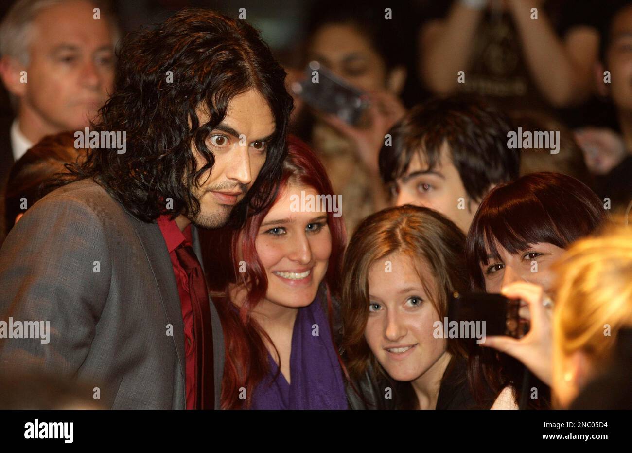 English comedian and actor Russell Brand poses for a picture with fans ...