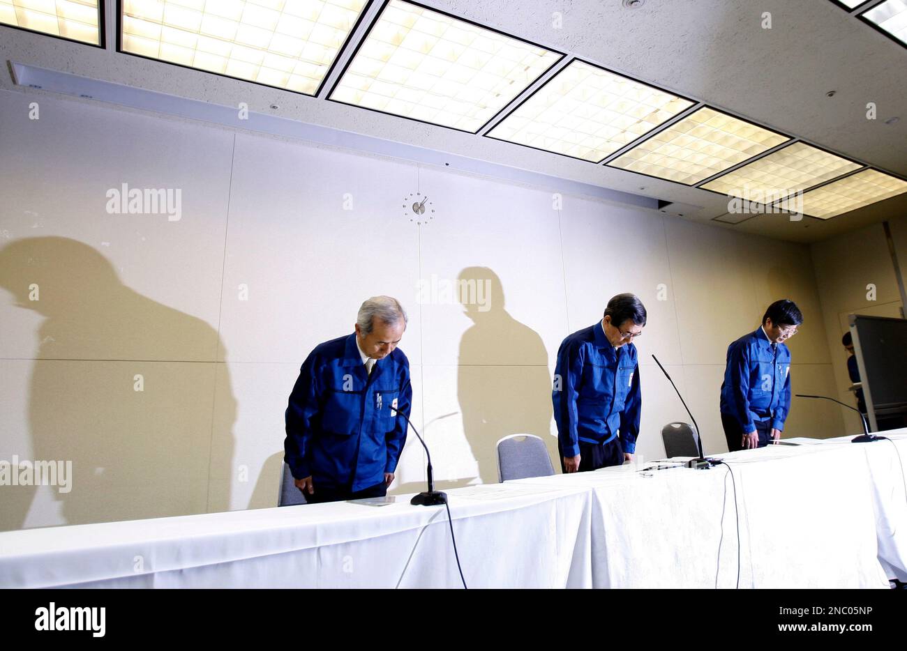 Tokyo Electric Power Co. (TEPCO) President Masataka Shimizu, center ...