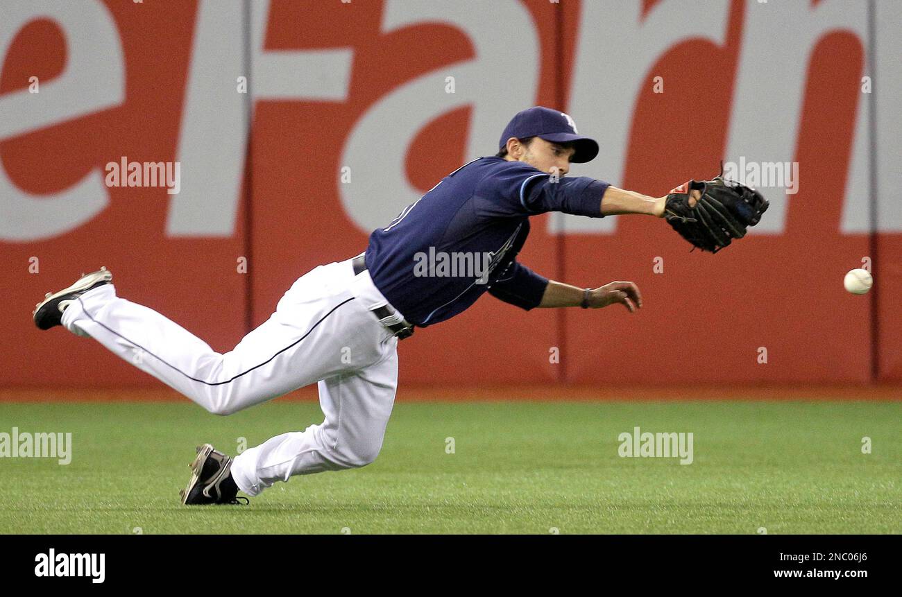 Tampa Bay Rays left fielder Sam Fuld dives but can't come up with a ...