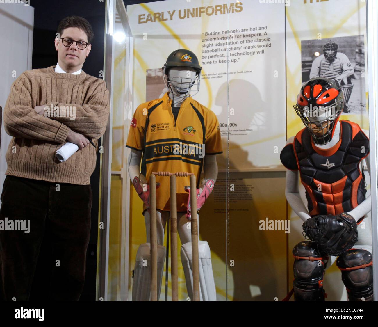 Senior Curator Tom Shieber poses with uniforms worn by a cricket wicket ...