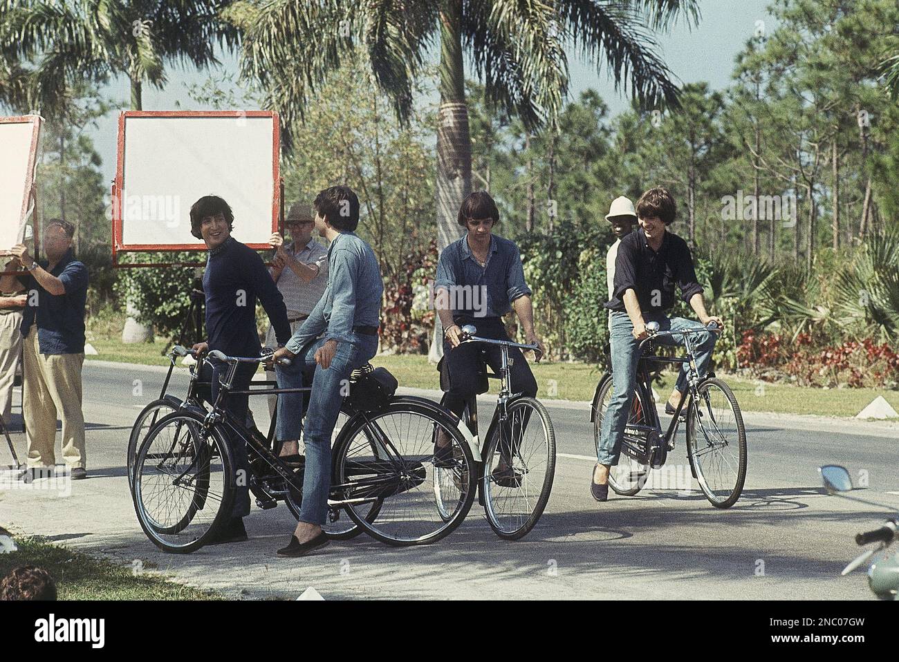 The Beatles sit on bicycles during the filming of "Help!" in Nassau ...