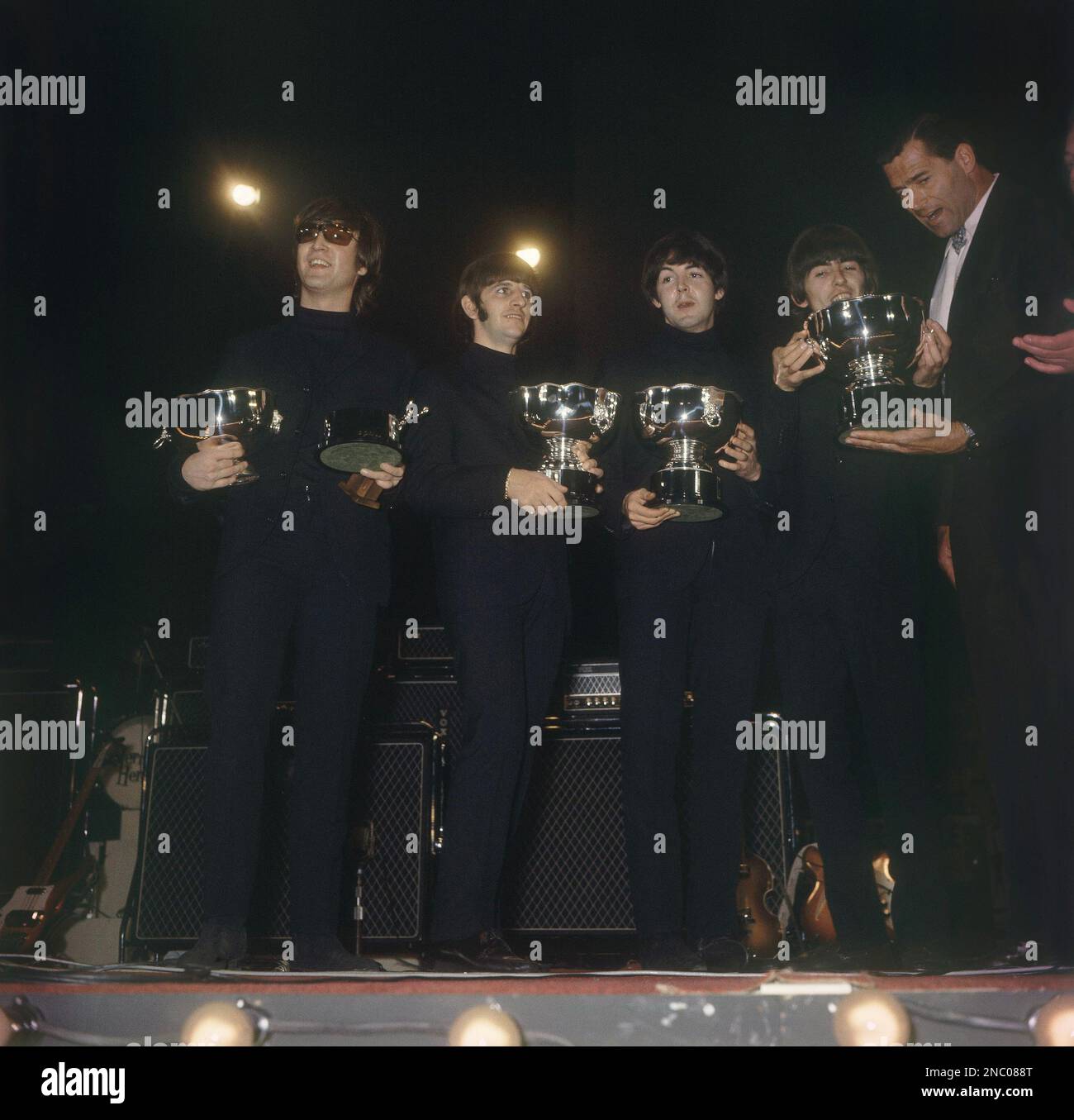 The Beatles pose with their awards during the New Musical Express ...