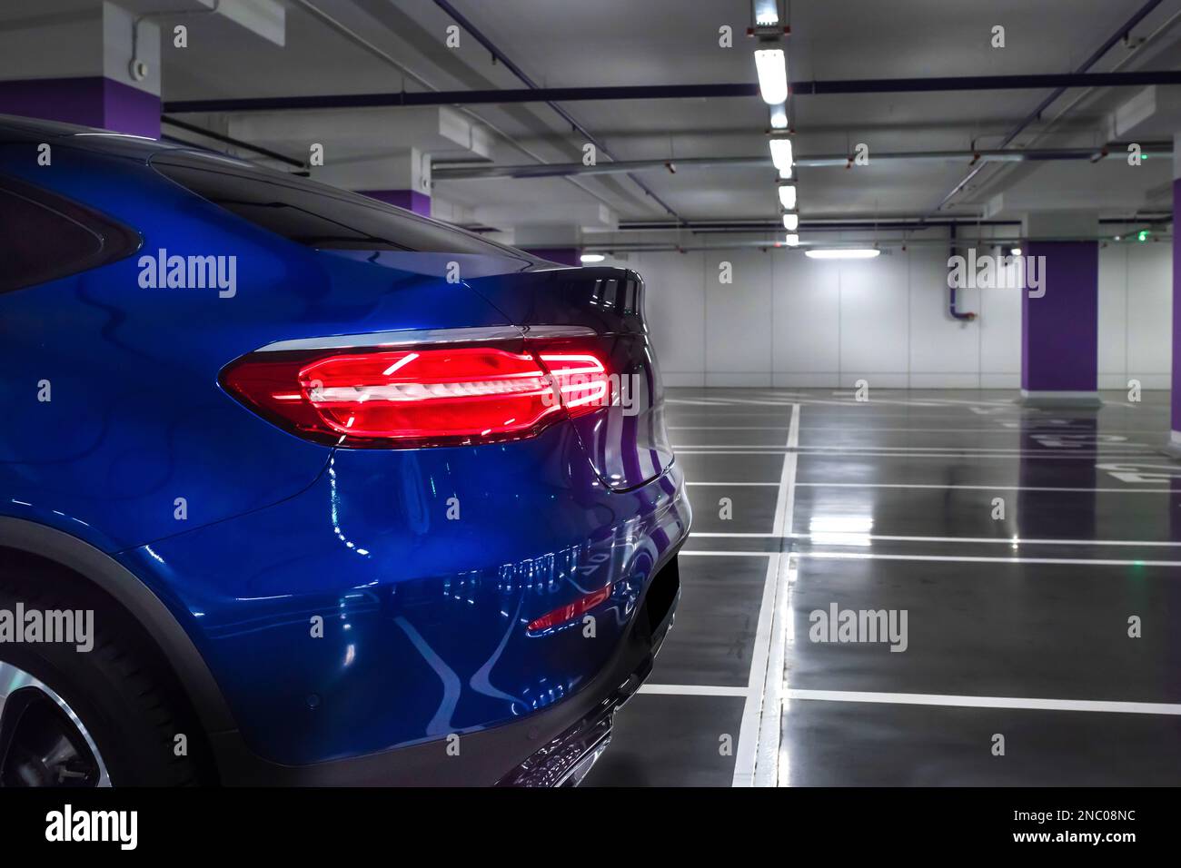 A close-up of a back side of a car in a parking lot Stock Photo - Alamy