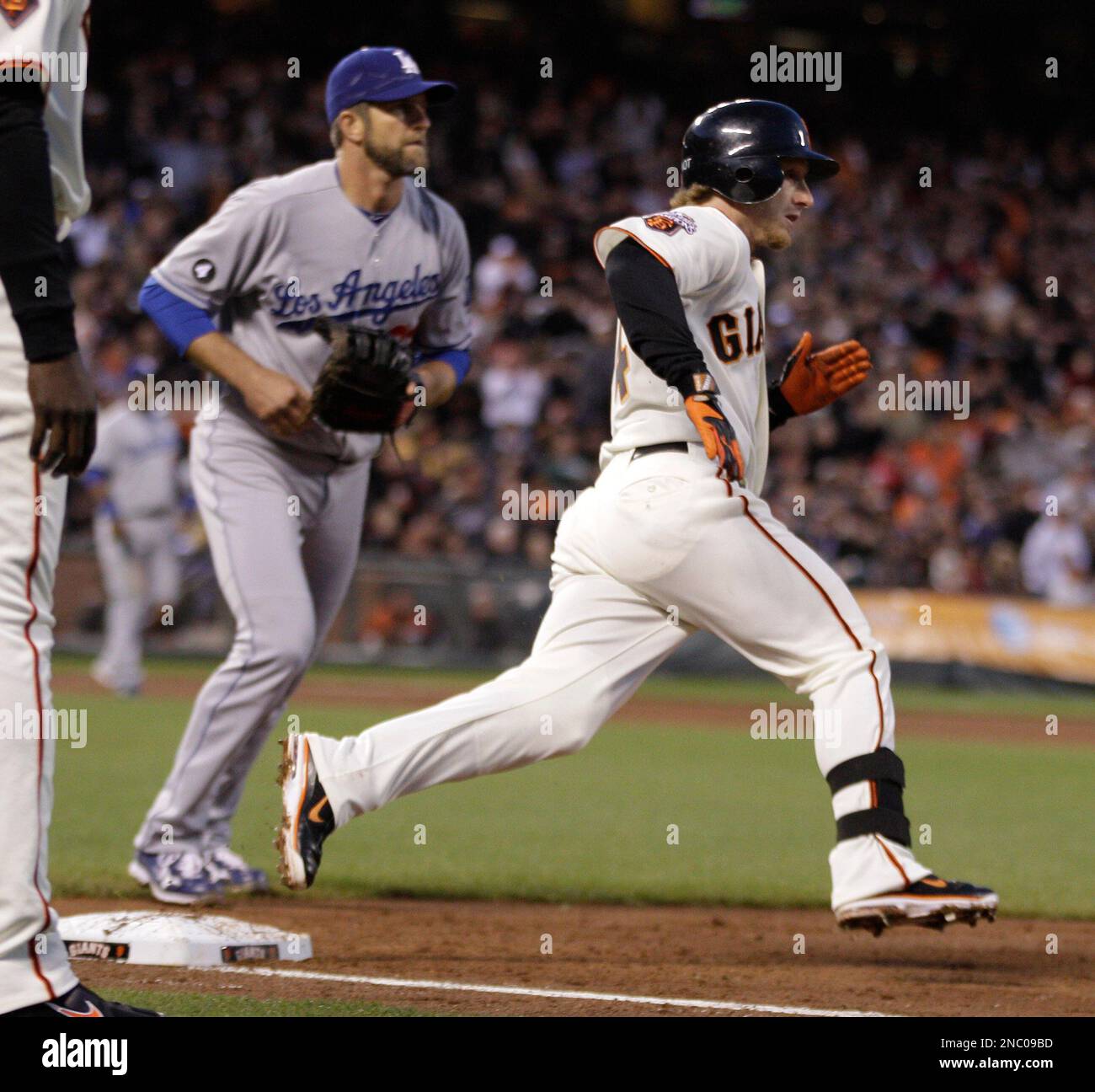 San Francisco Giants' Mike Fontenot, right, runs past first base and ...