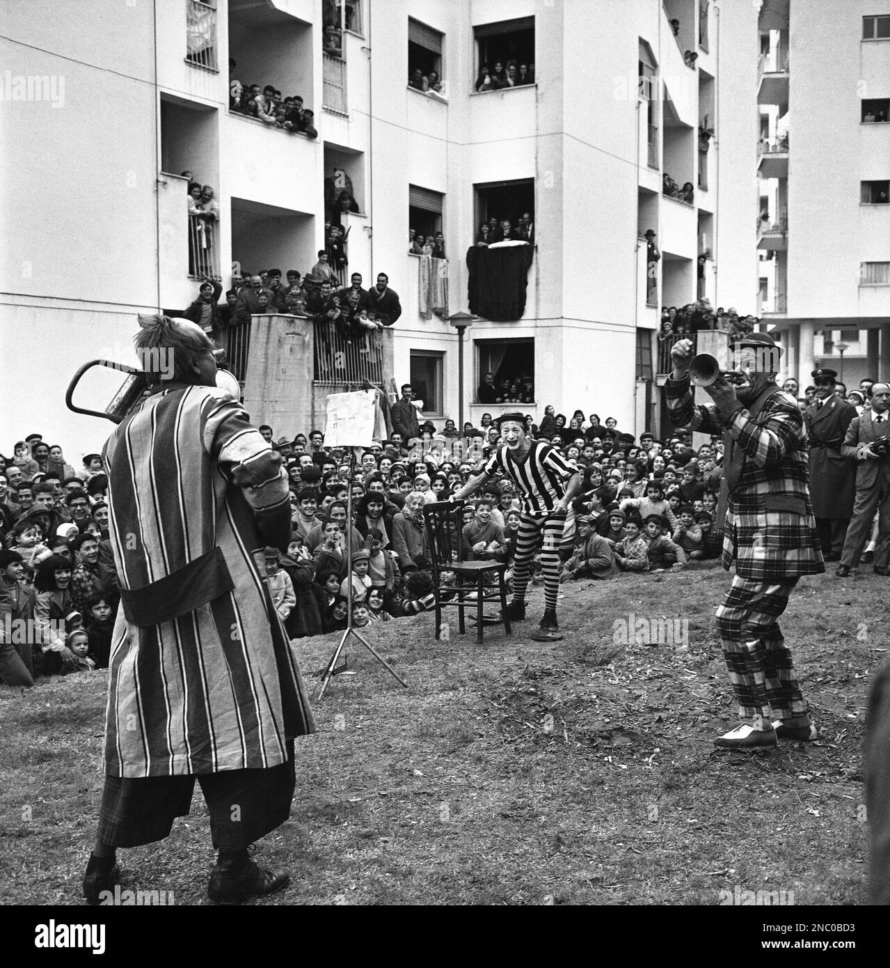Clowns from the Orfei Circus performing in a courtyard of the Loggetta ...
