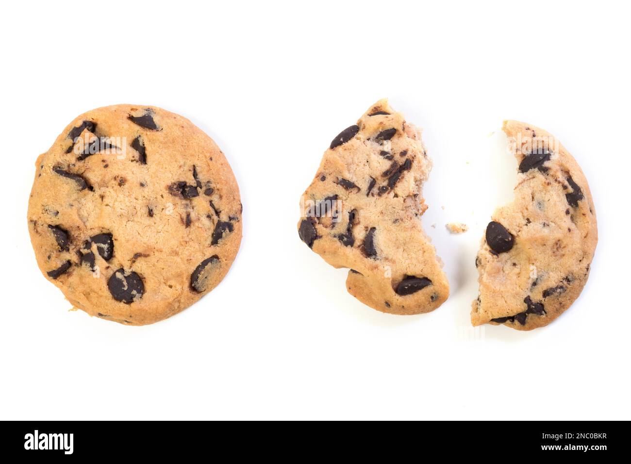 Broken chocolate cookies at the white background. A view from above ...